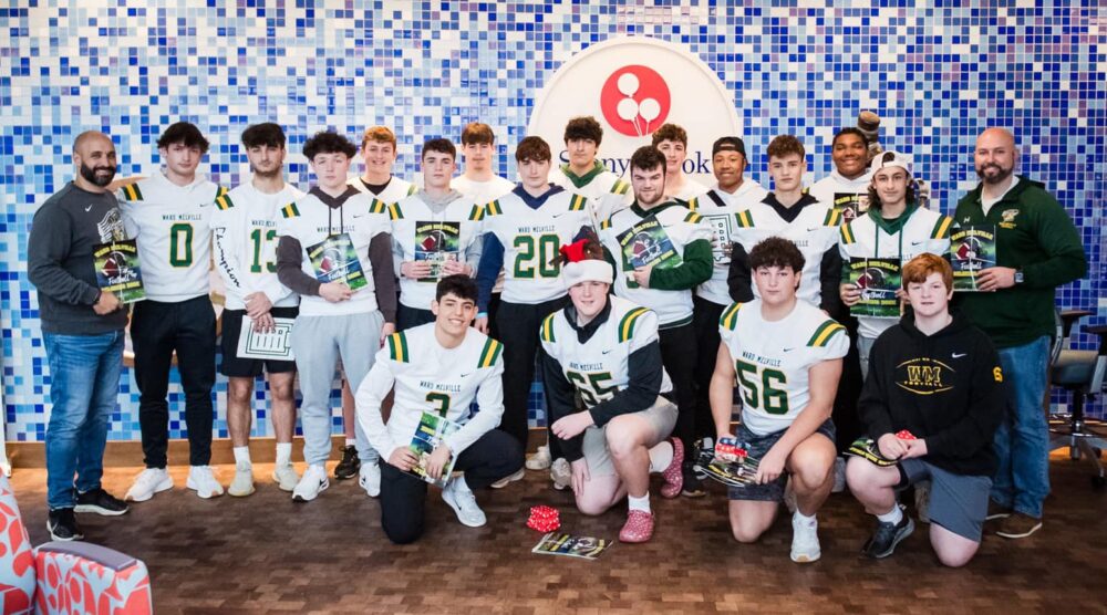 Festive Off The Field: Football Team Makes Donation To Stony Brook ...